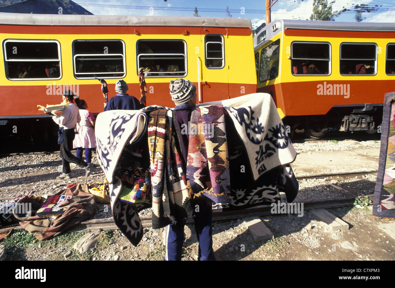 Peru, man selling carpet at railway station Stock Photo - Alamy