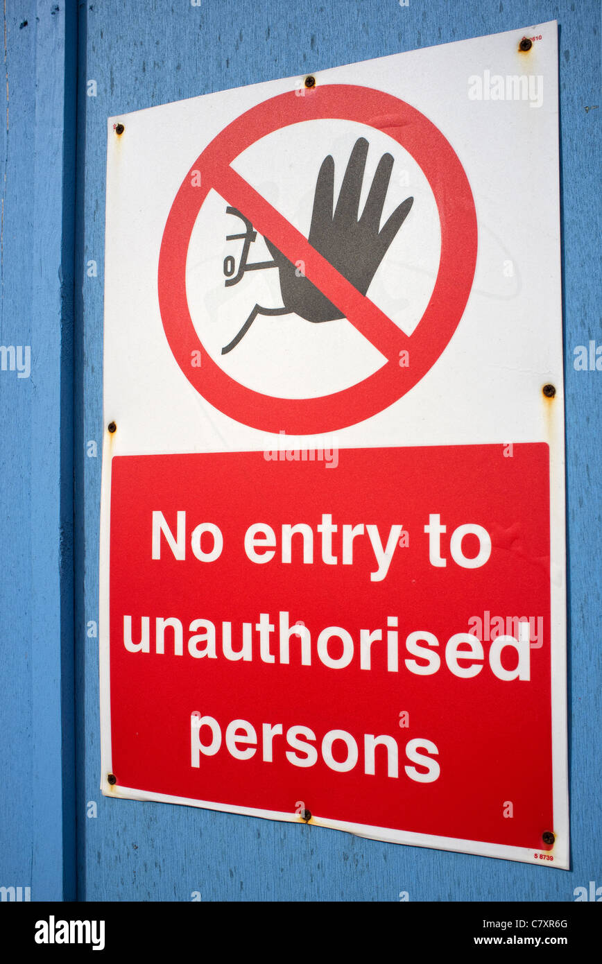 No entry to unauthorised persons sign on a door Stock Photo - Alamy