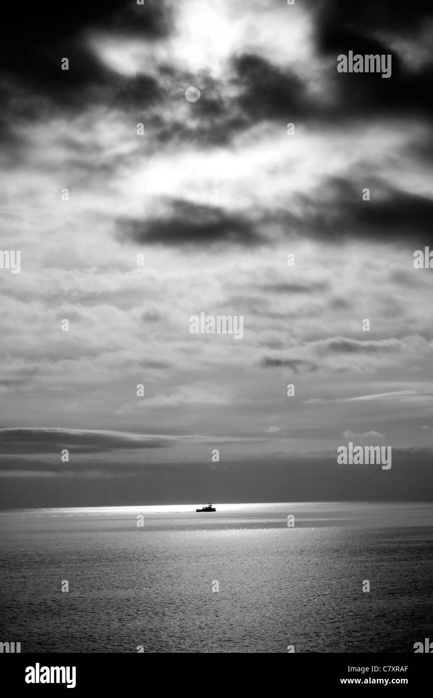 Black and White shot of Ferry in Torbay backlit, boats, cliff, coast ...