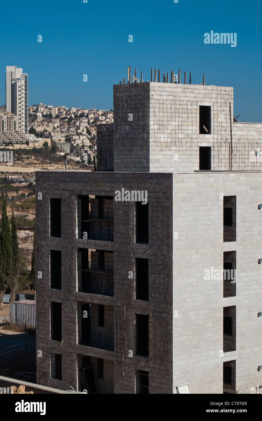 Apartment building under construction in the Arab neighborhood of Bet ...