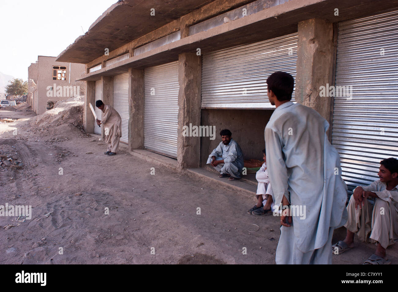 Pakistani workers play cricket in Kabul Afghanistan, September 2004 ...