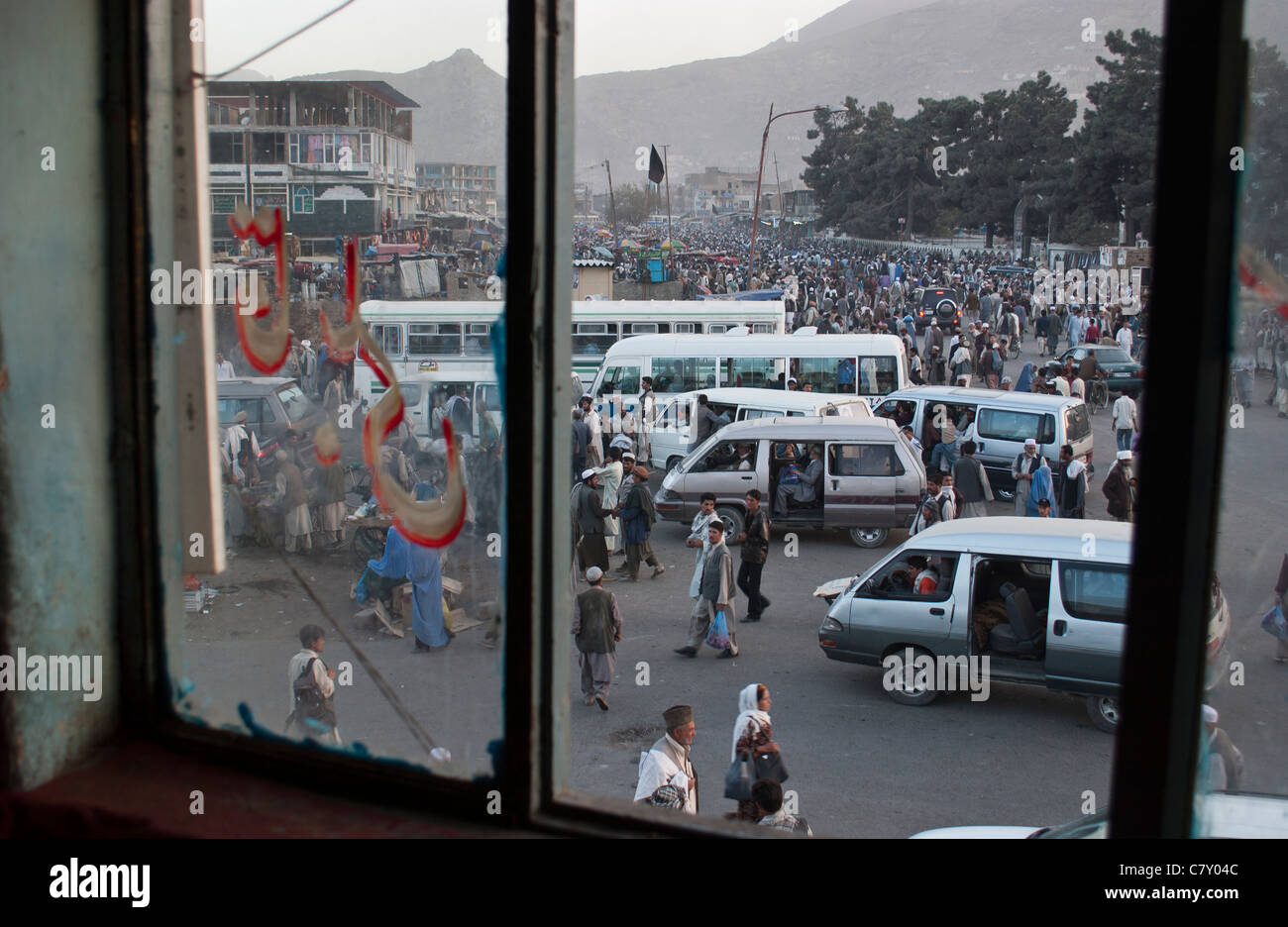 Buses and mini-buses wait for passengers in central Kabul, Afghanistan ...