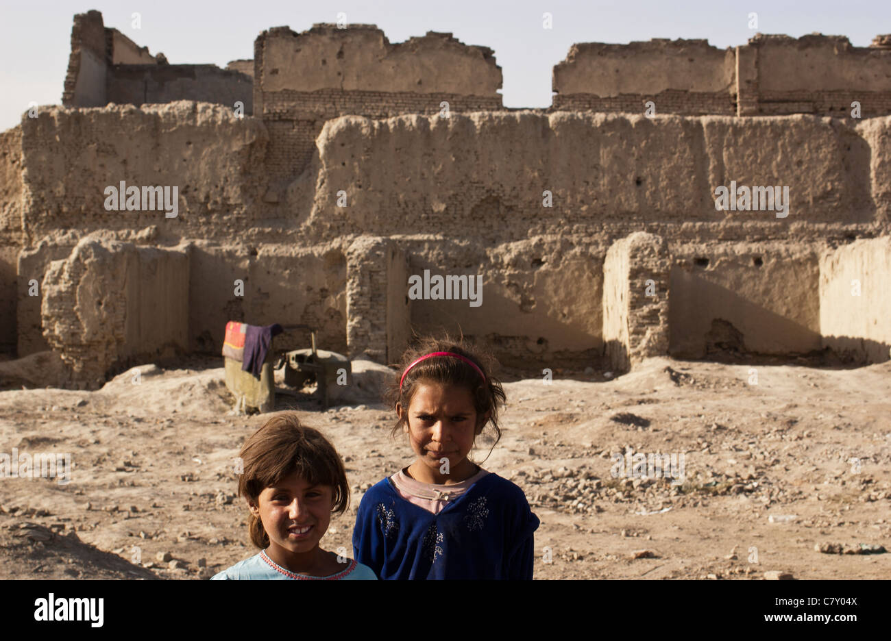 Internally displaced refugee children pose for a photo in an open lot ...