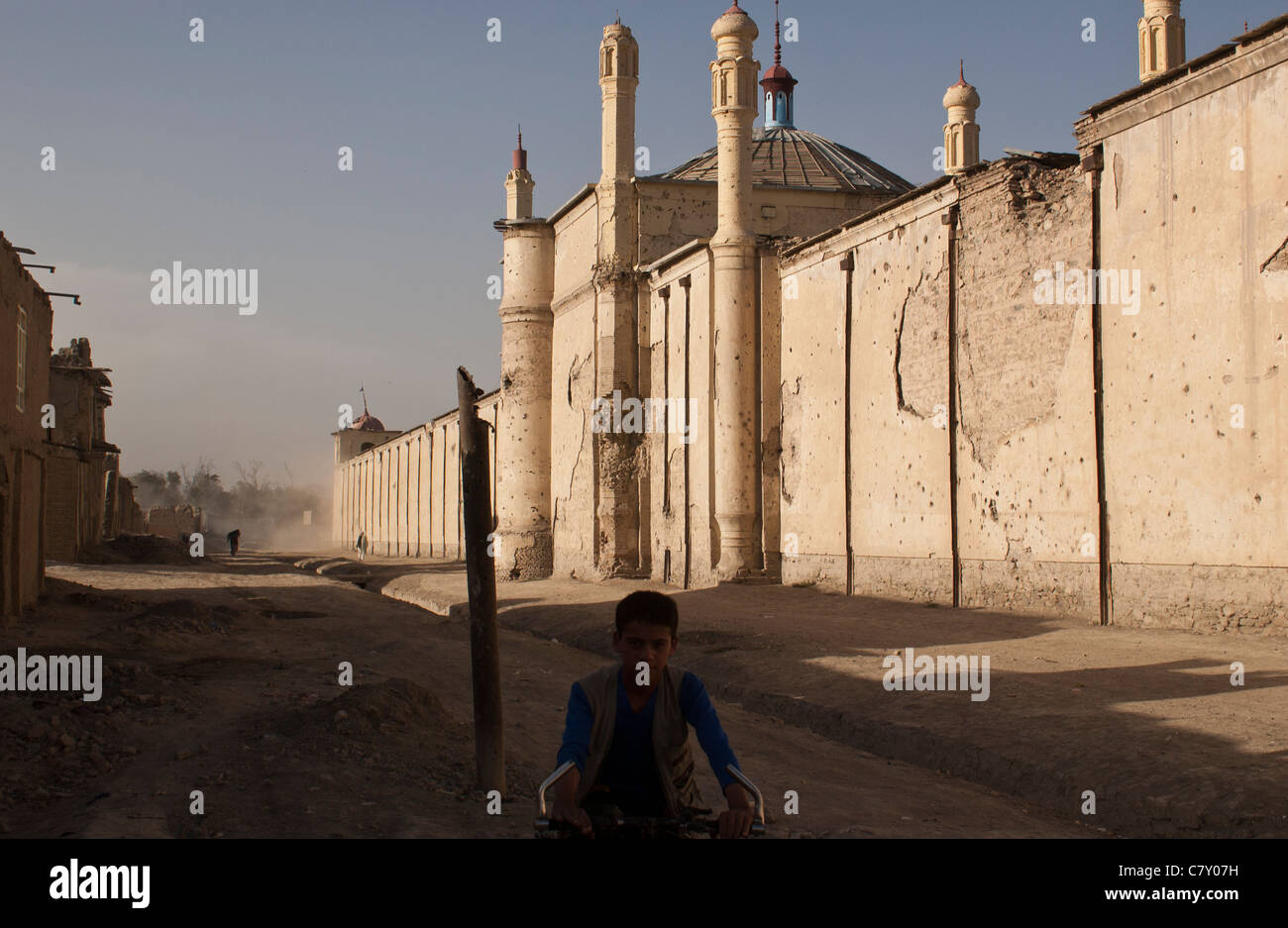 A boy cycles by Id Gah (Eid Gah) Mosque in Kabul Afghanistan, September ...
