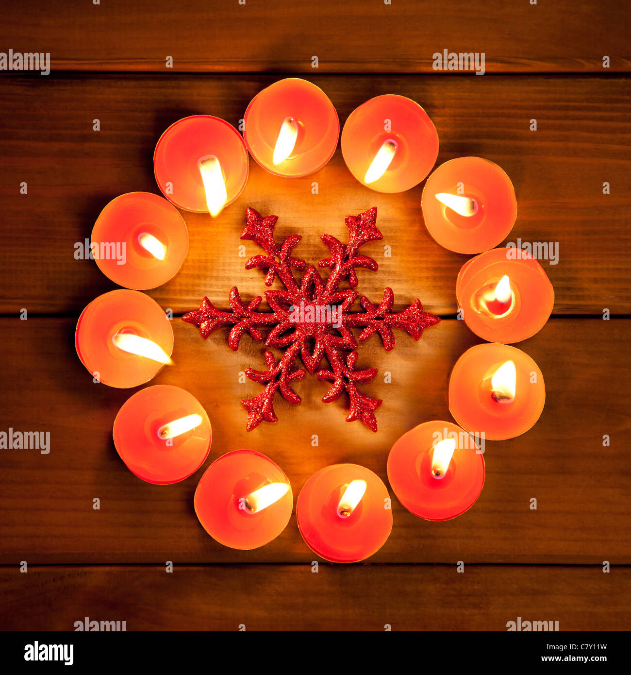 christmas candles circle over wood and red snowflake symbol Stock Photo ...