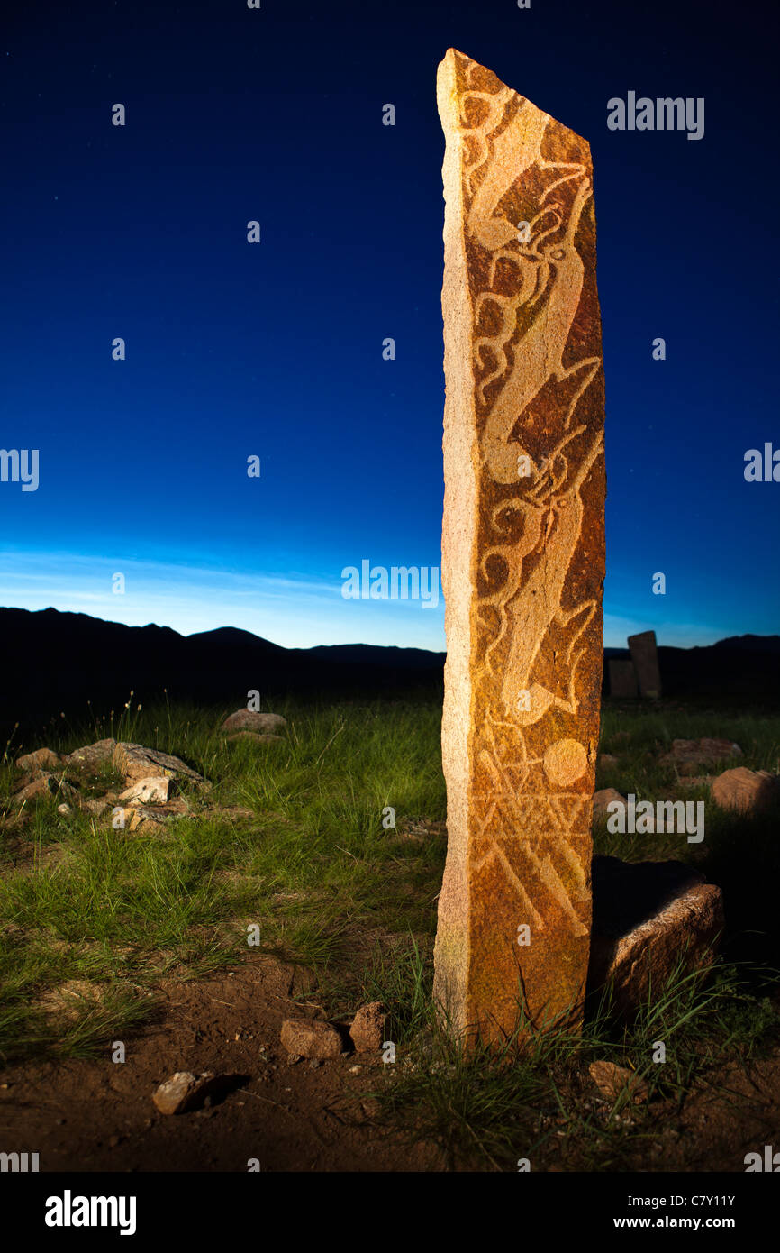 Age of Bronze Deer stone with blue dusk in Moron, Mongolia Stock Photo ...