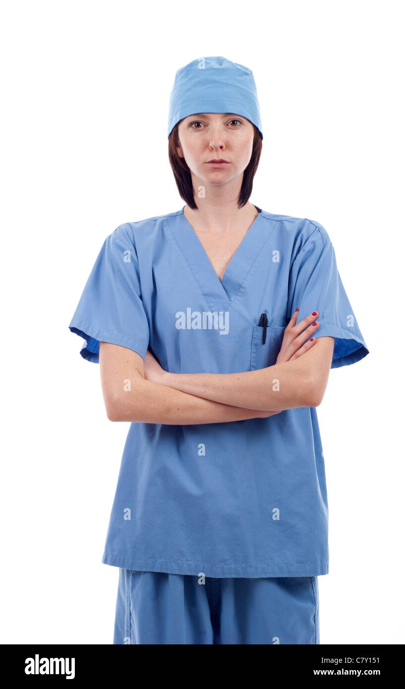 Serious looking doctor, nurse in scrubs isolated over white background ...