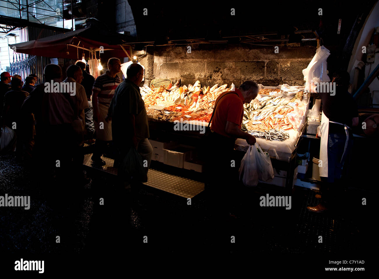 Traditional fish shop selling seafood at old market in Catania, Sicily ...