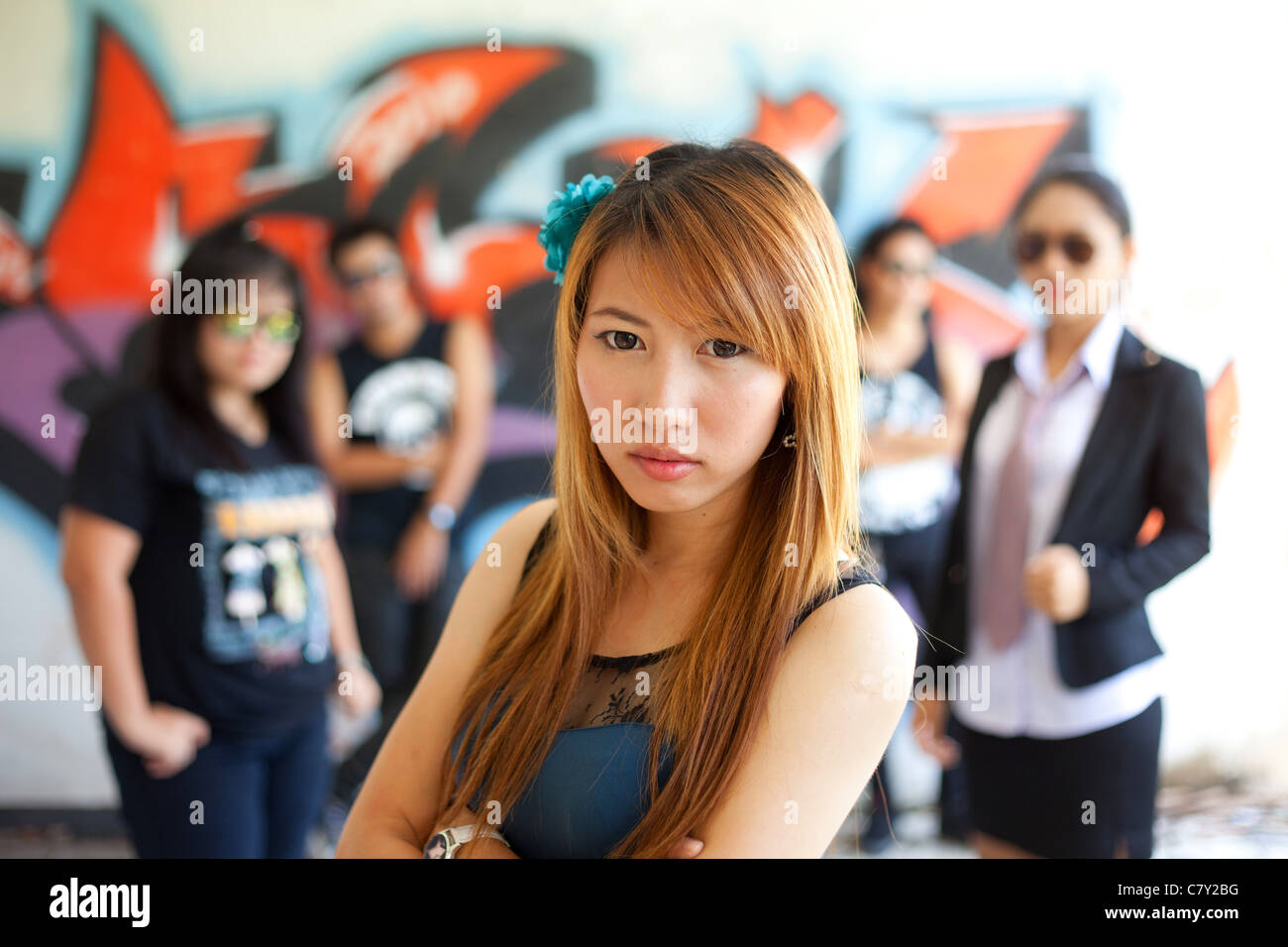 Influential women and her gang in a graffiti painted Stock Photo - Alamy