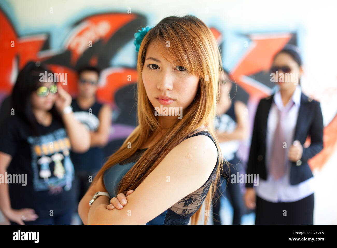 Influential women and her gang in a graffiti painted Stock Photo - Alamy