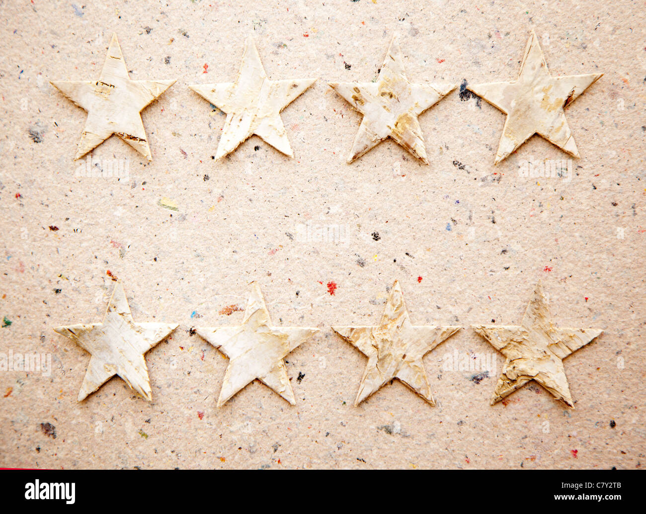 christmas stars on recycled paper background as an ecology metaphor ...