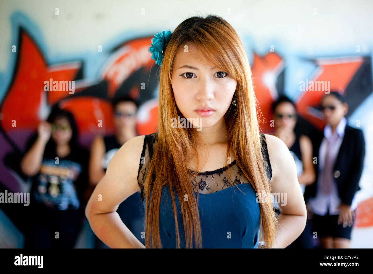 Influential women and her gang in a graffiti painted Stock Photo - Alamy