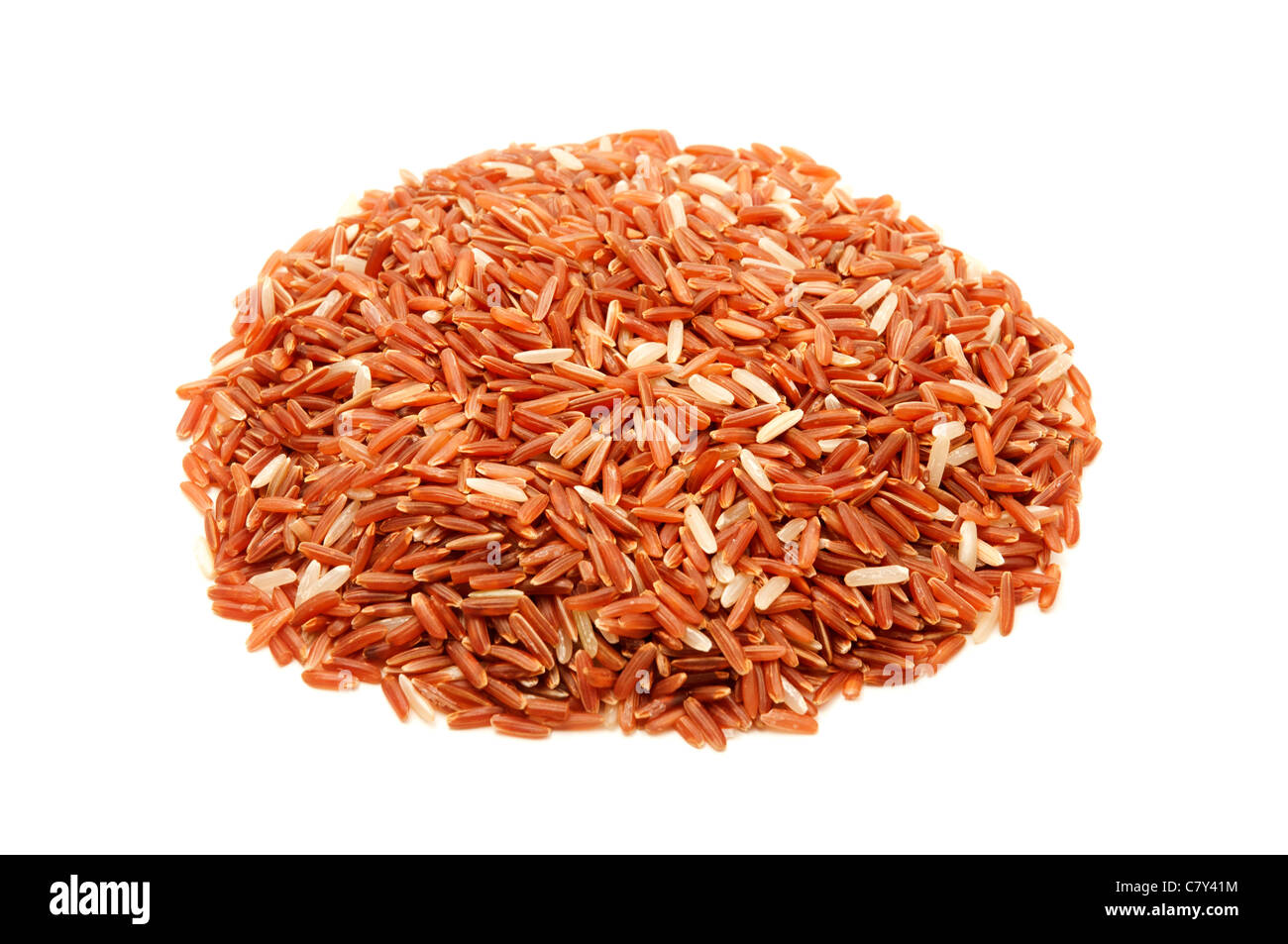 Red cargo rice on a white background Stock Photo - Alamy
