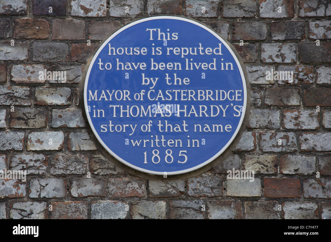 A blue ceramic plaque indicates the fictional home of Michael Henchard ...