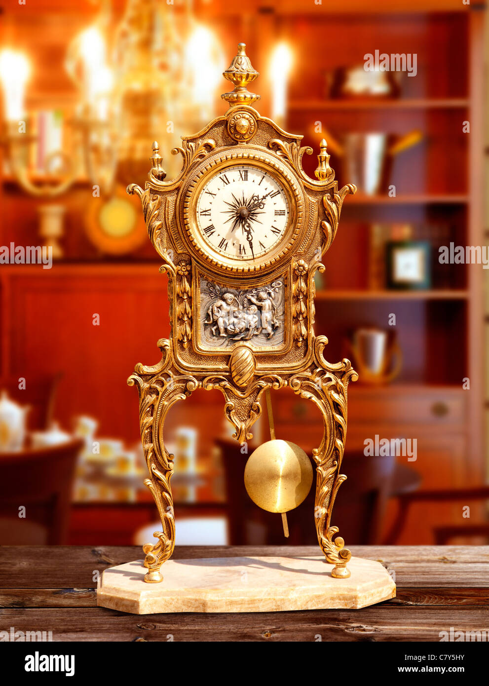 ancient vintage brass pendulum clock Stock Photo - Alamy