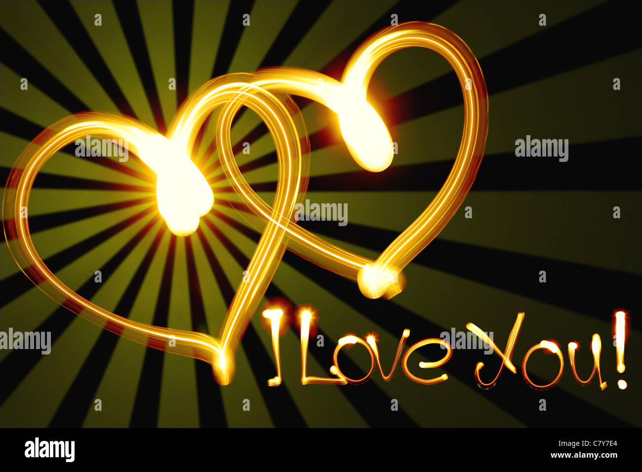 Two hearts created by light over black background Stock Photo - Alamy