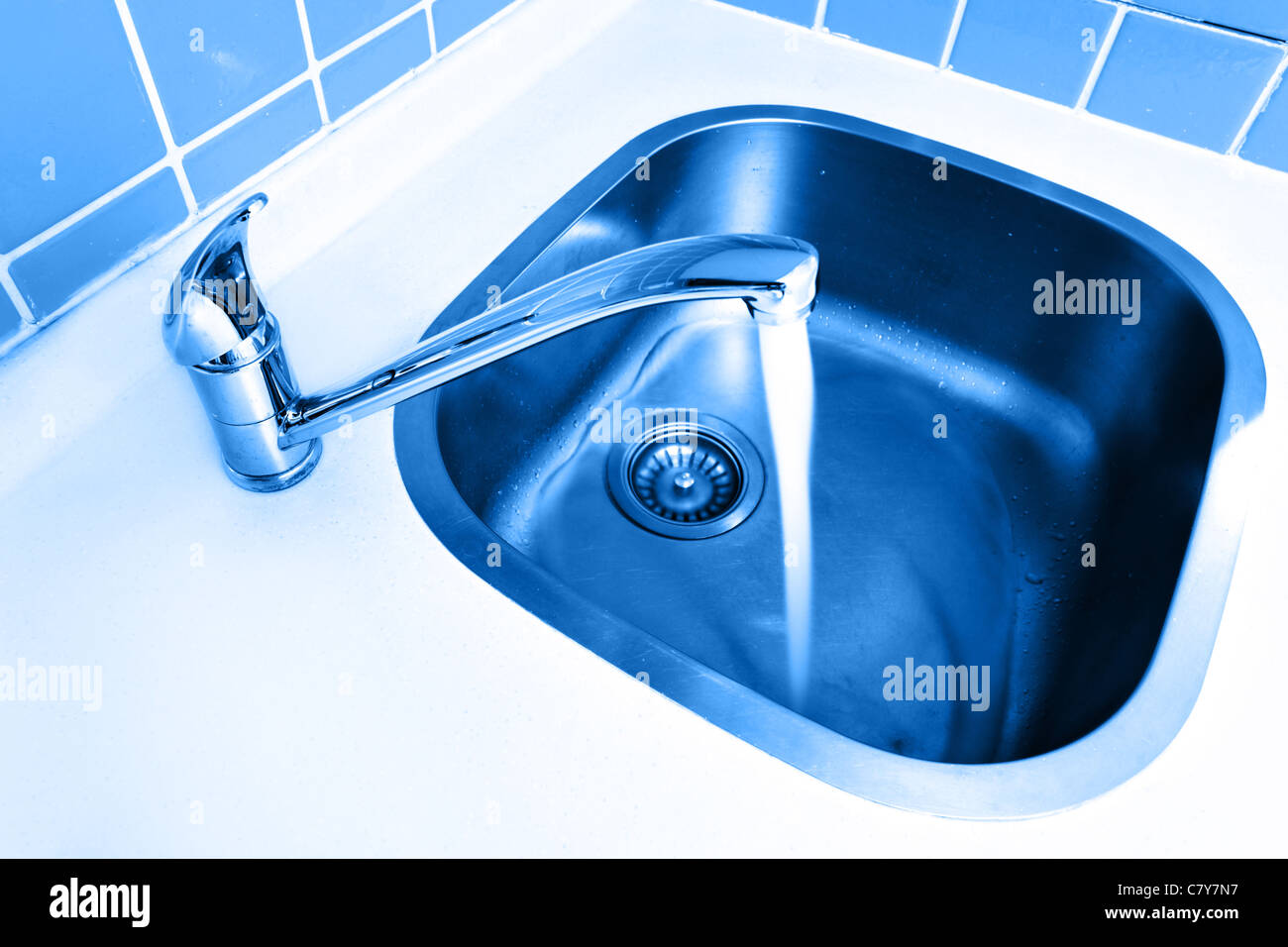 Water tap close-up with flowing fresh water Stock Photo - Alamy
