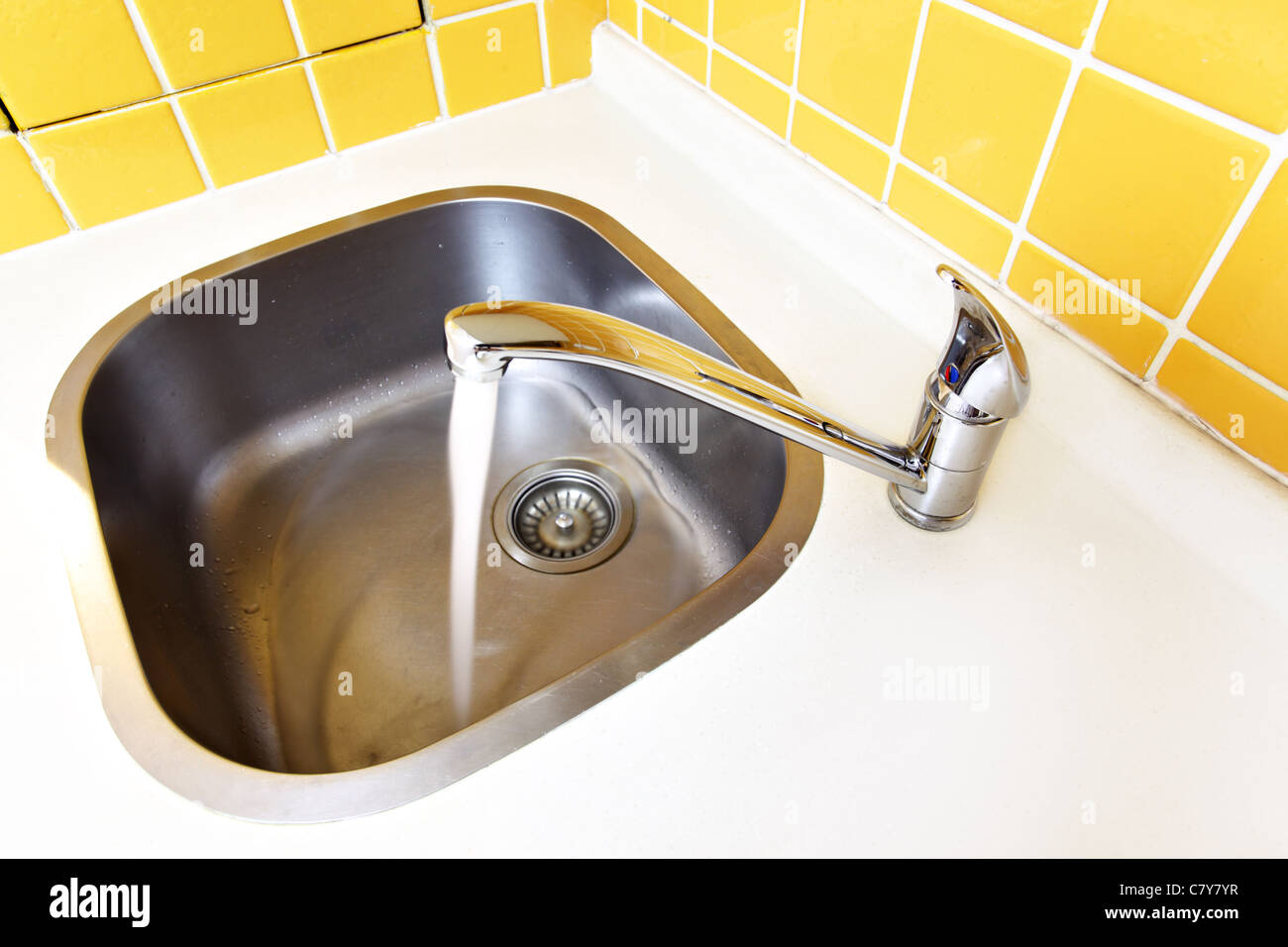 Water tap close-up with flowing fresh water Stock Photo - Alamy