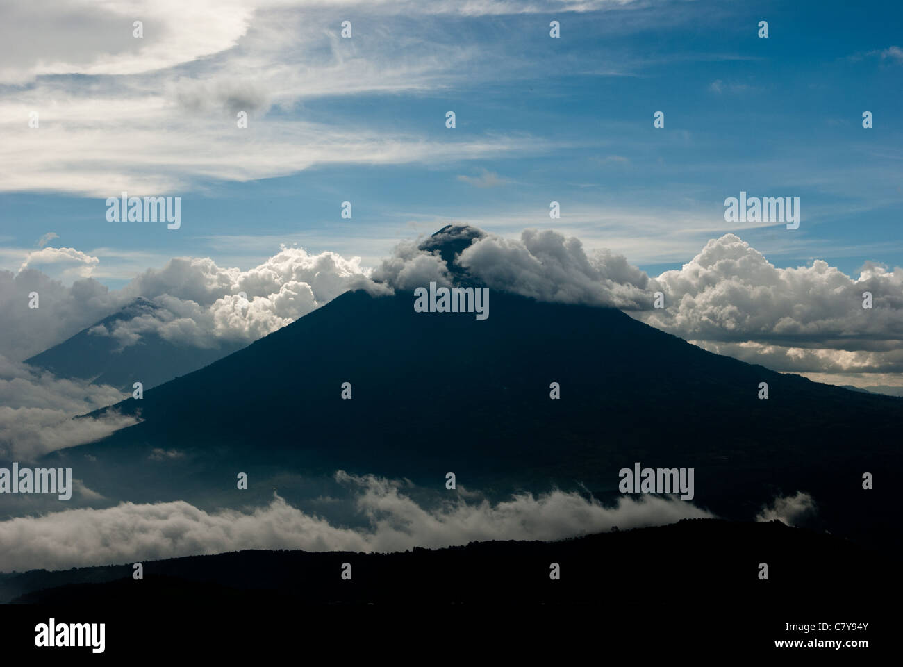 Guatemalan volcano over antigua city shrouded in cloud Stock Photo - Alamy