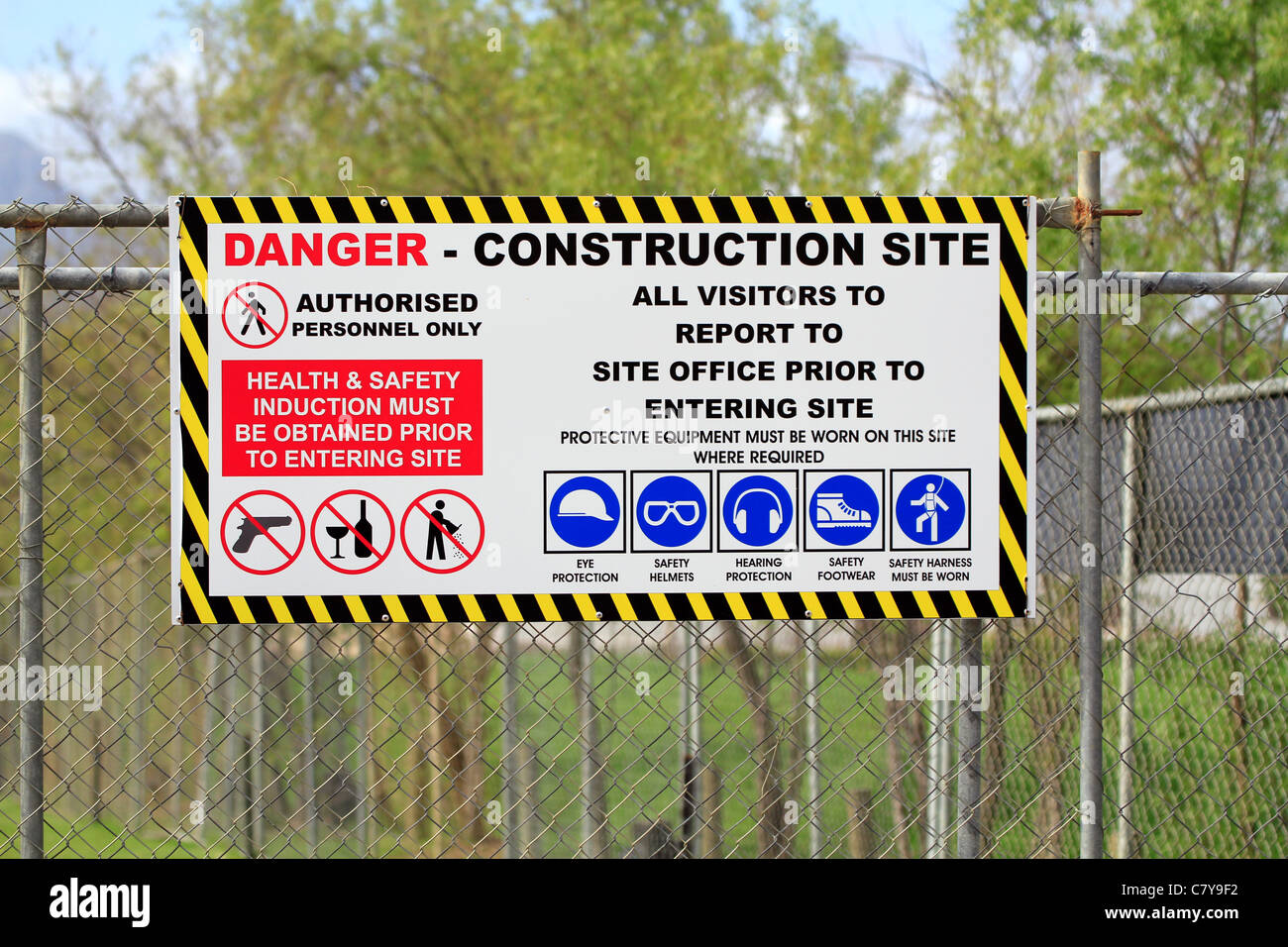 Public safety warning sign at construction site Stock Photo - Alamy