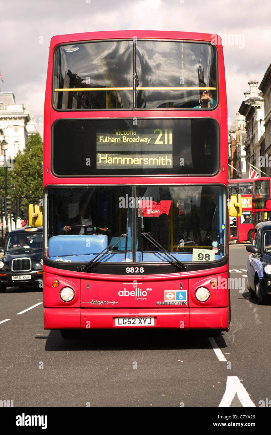 a double decker red London bus traveling in London Stock Photo - Alamy