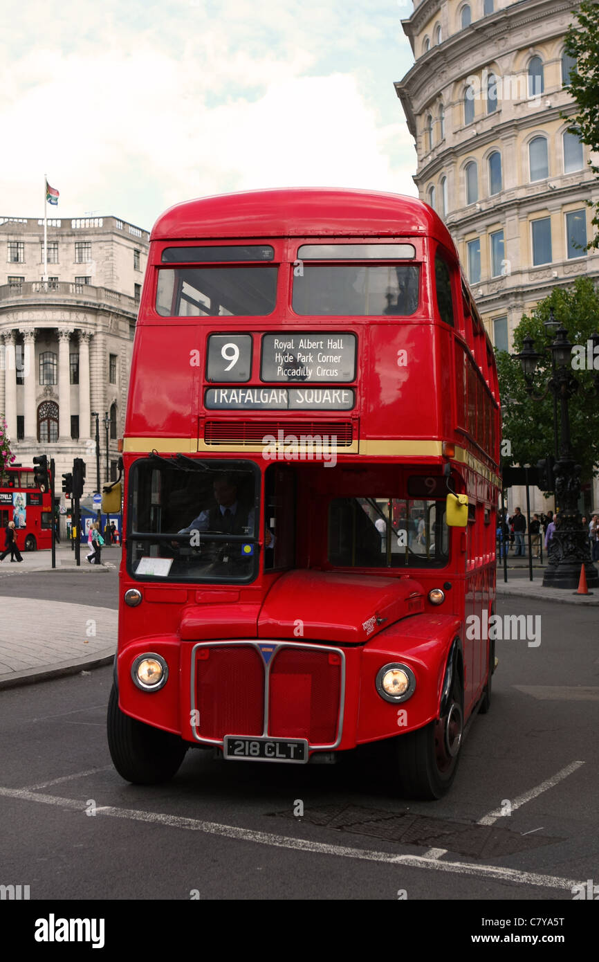 a double decker red London routemaster bus traveling in London Stock ...
