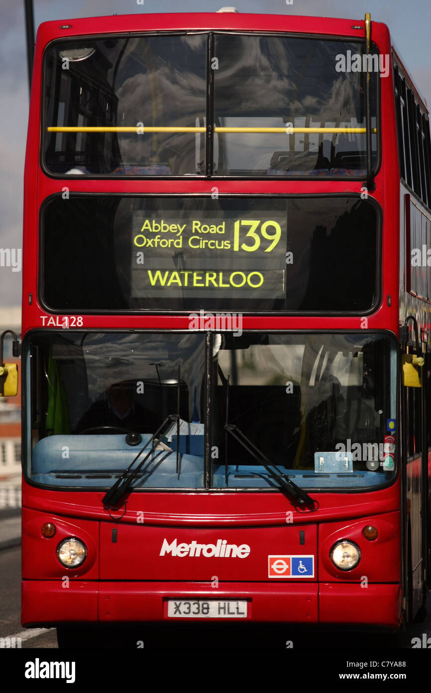 a double decker red London bus traveling in London Stock Photo - Alamy