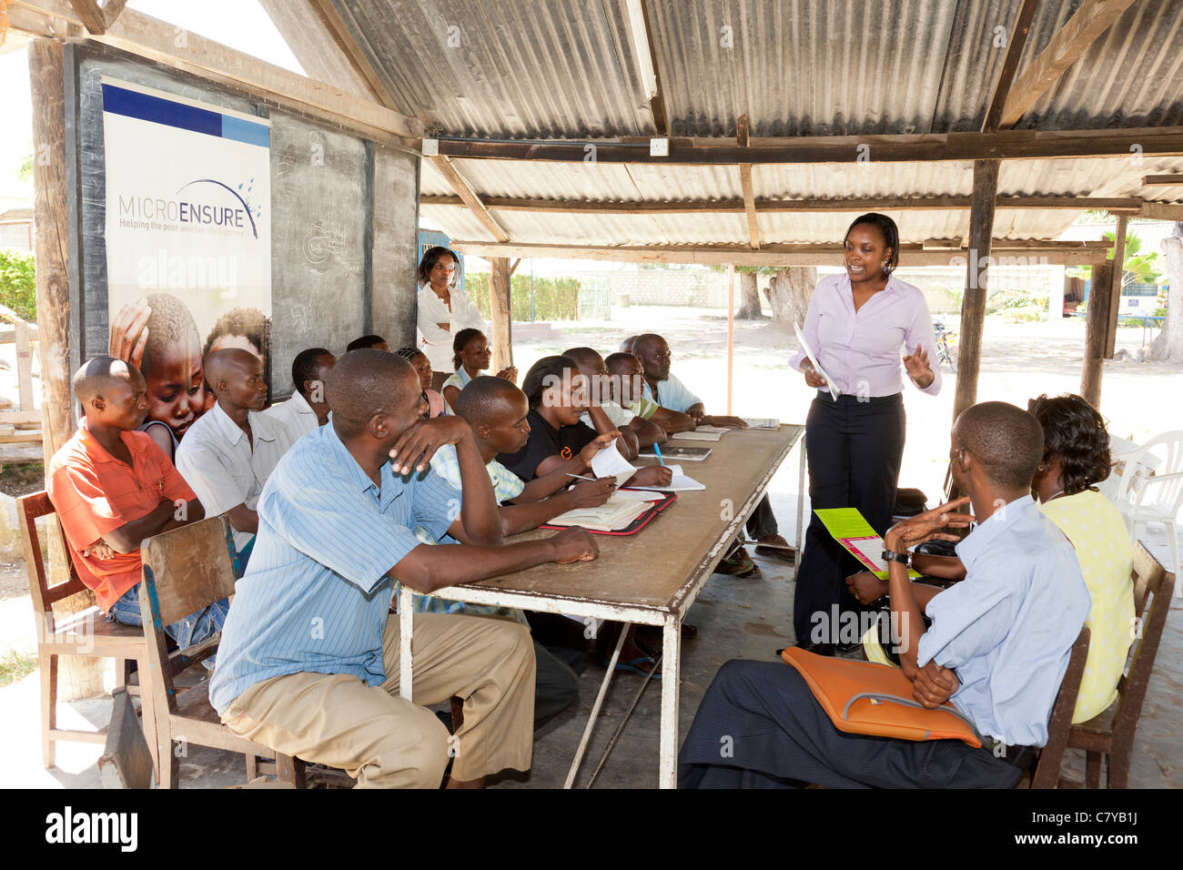 MicroEnsure agent talks to microfinance clients about microinsurance at ...