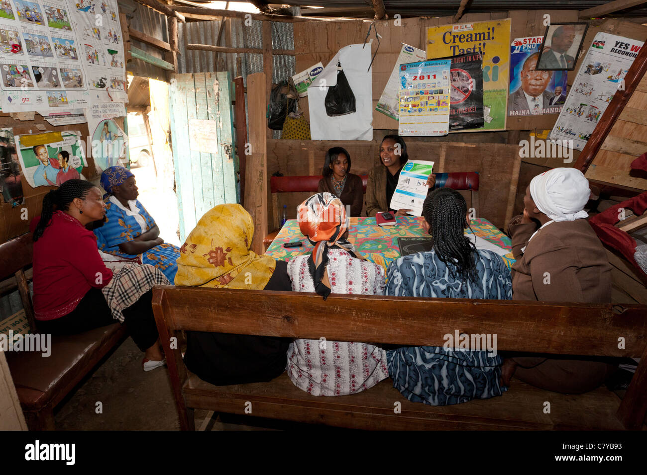 MicroEnsure agent talks to microfinance clients about microinsurance at ...