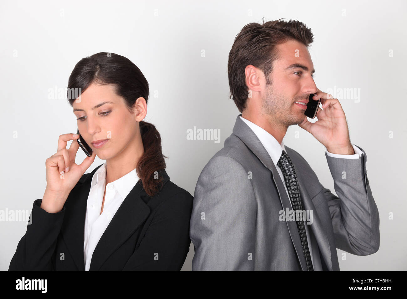 Business professionals talking to their better halves Stock Photo - Alamy