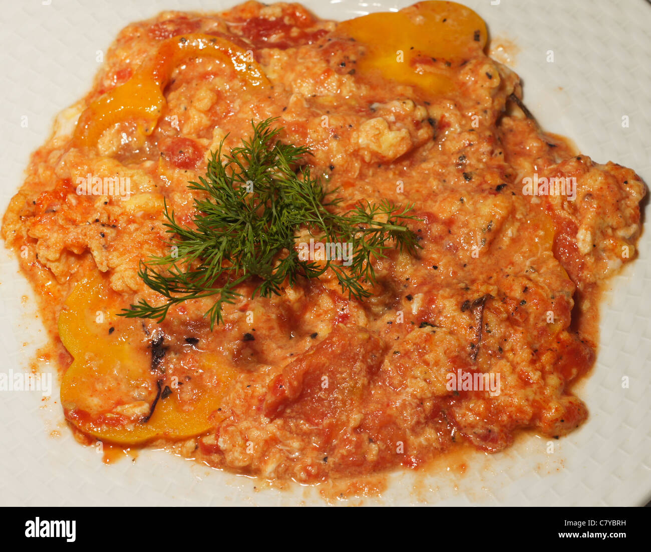Scrambled eggs (omelet) with tomato Stock Photo - Alamy