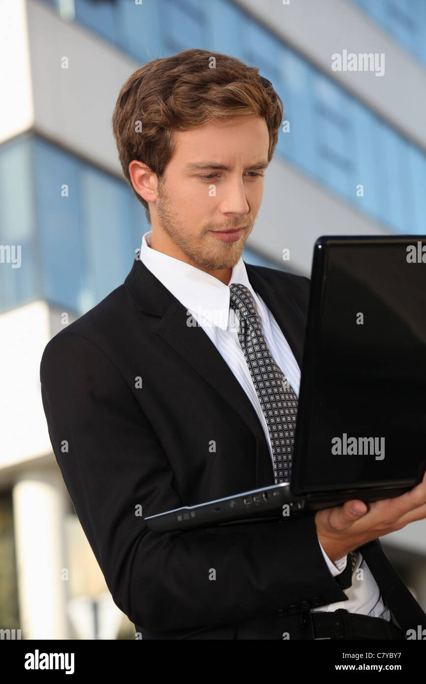 Businessman on laptop Stock Photo - Alamy