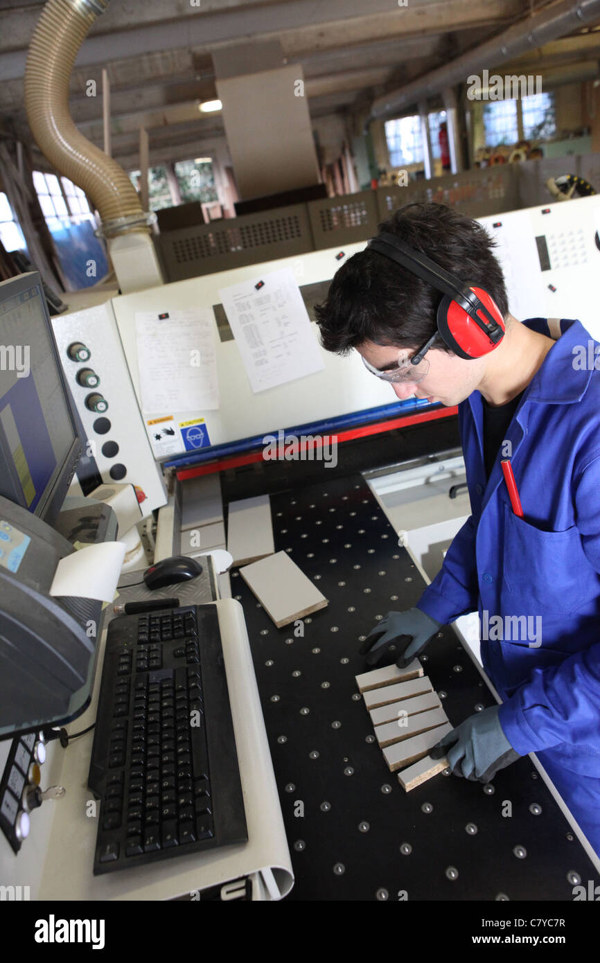 Young man working in workshop Stock Photo - Alamy