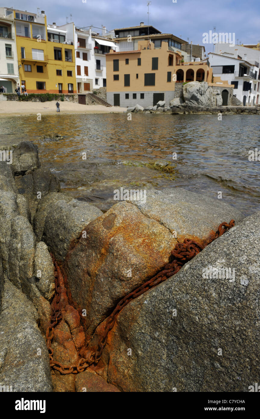 Calella beach, rocks and sea; a coastal village in the Spanish Costa ...