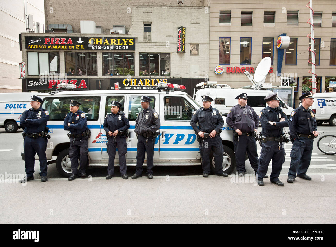 eight multiracial New York police officers on duty on Park Place lower ...