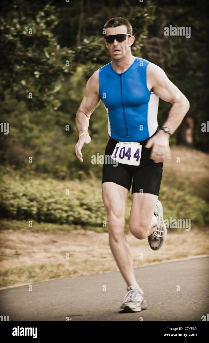 Man running in a triathlon, Seattle, WA USA Stock Photo - Alamy