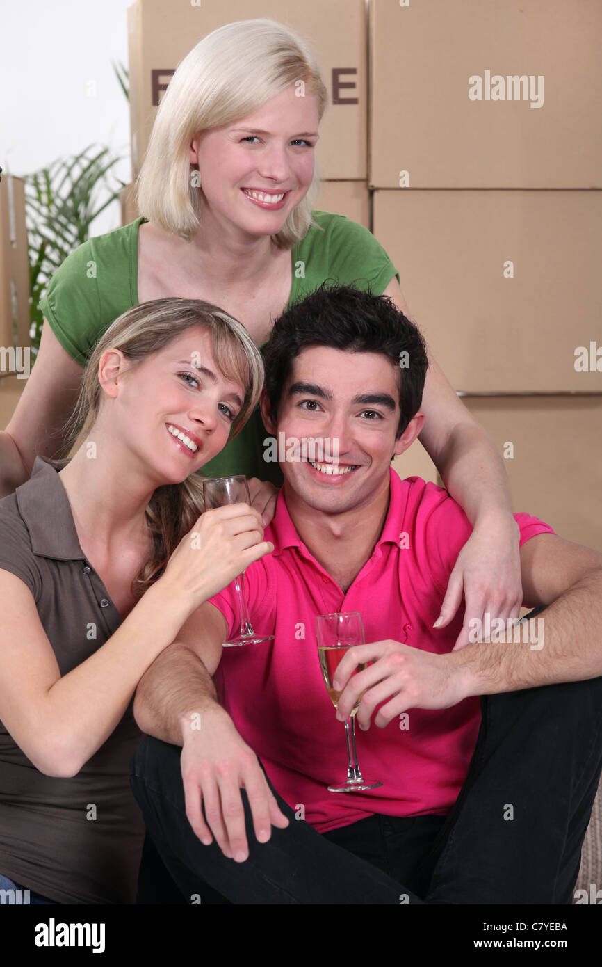 three housemates moving into new house Stock Photo - Alamy