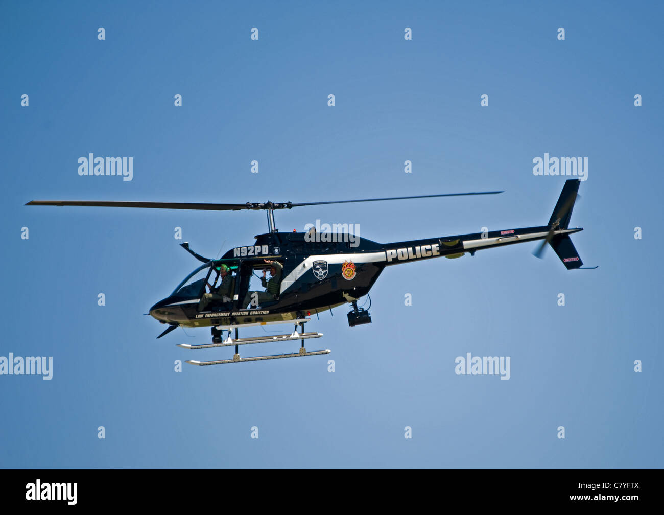 police helicopter flying on air show Stock Photo - Alamy