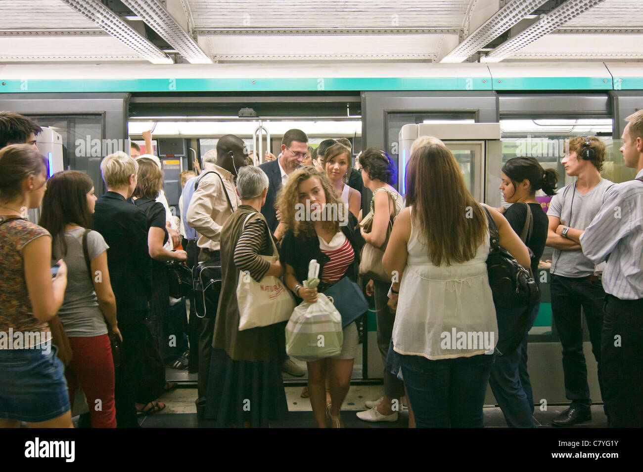 People in crowded Hotel de Ville subway station at rush hour - Paris ...