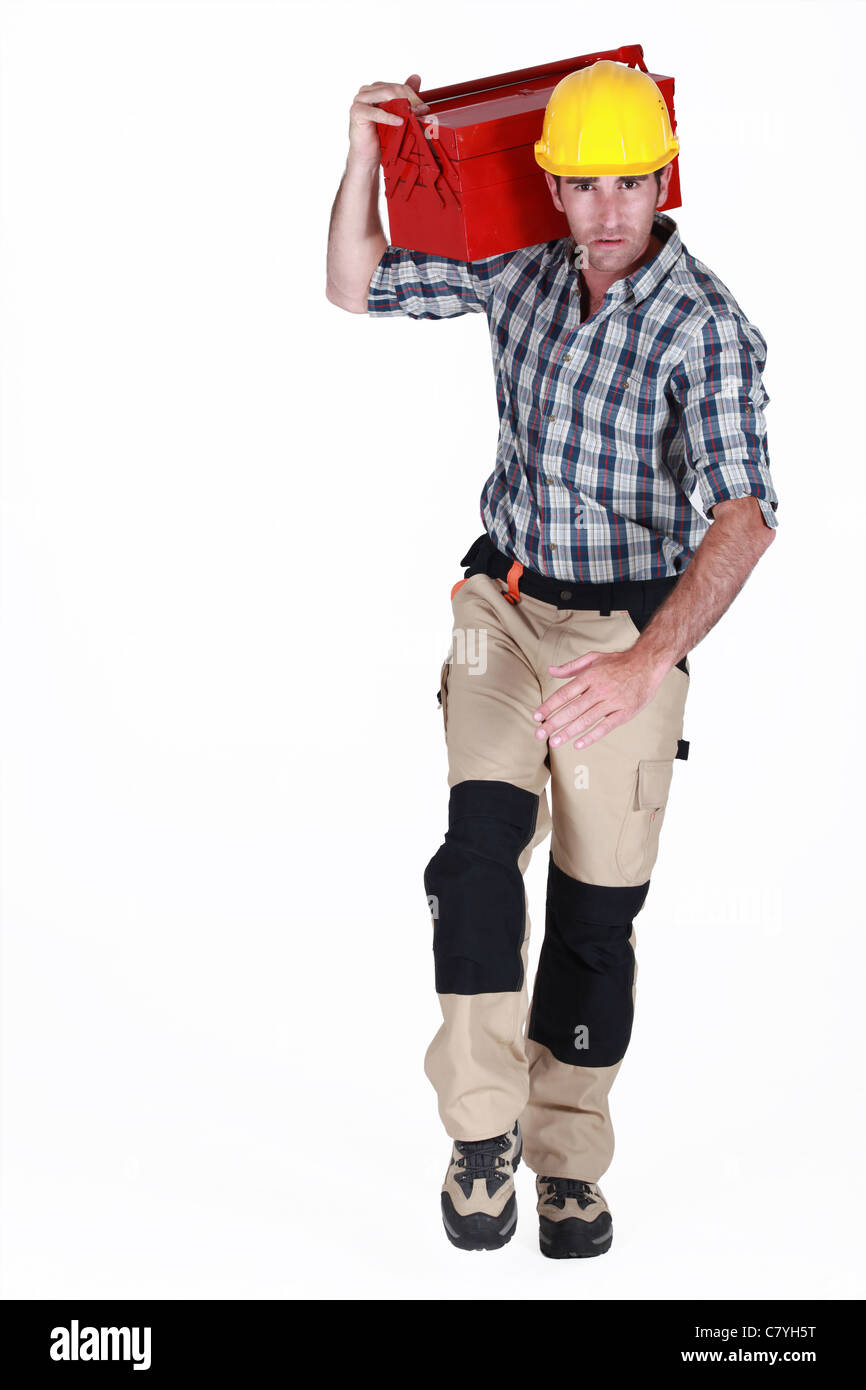 Worker running with a toolbox Stock Photo - Alamy