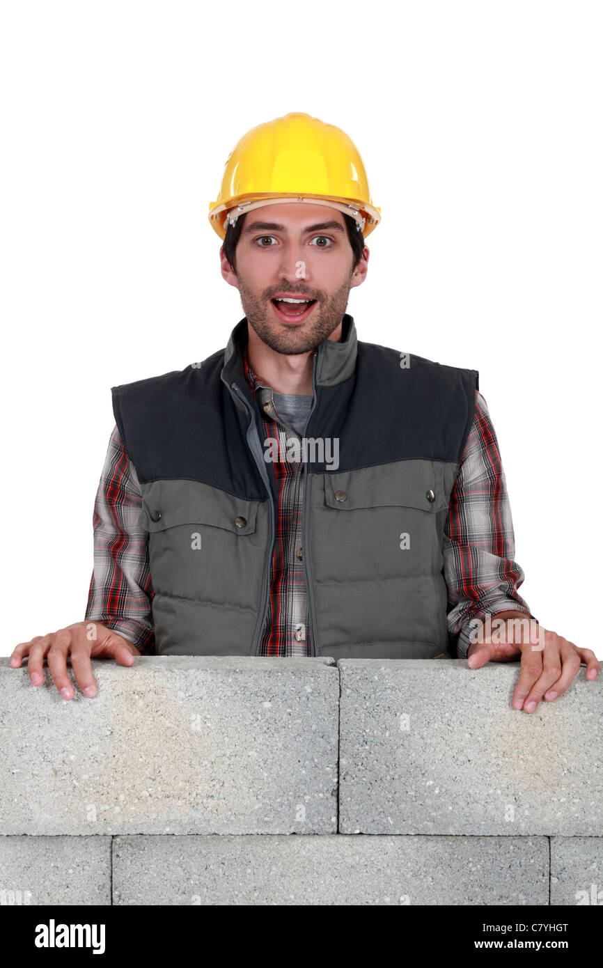 Surprised construction worker Stock Photo - Alamy
