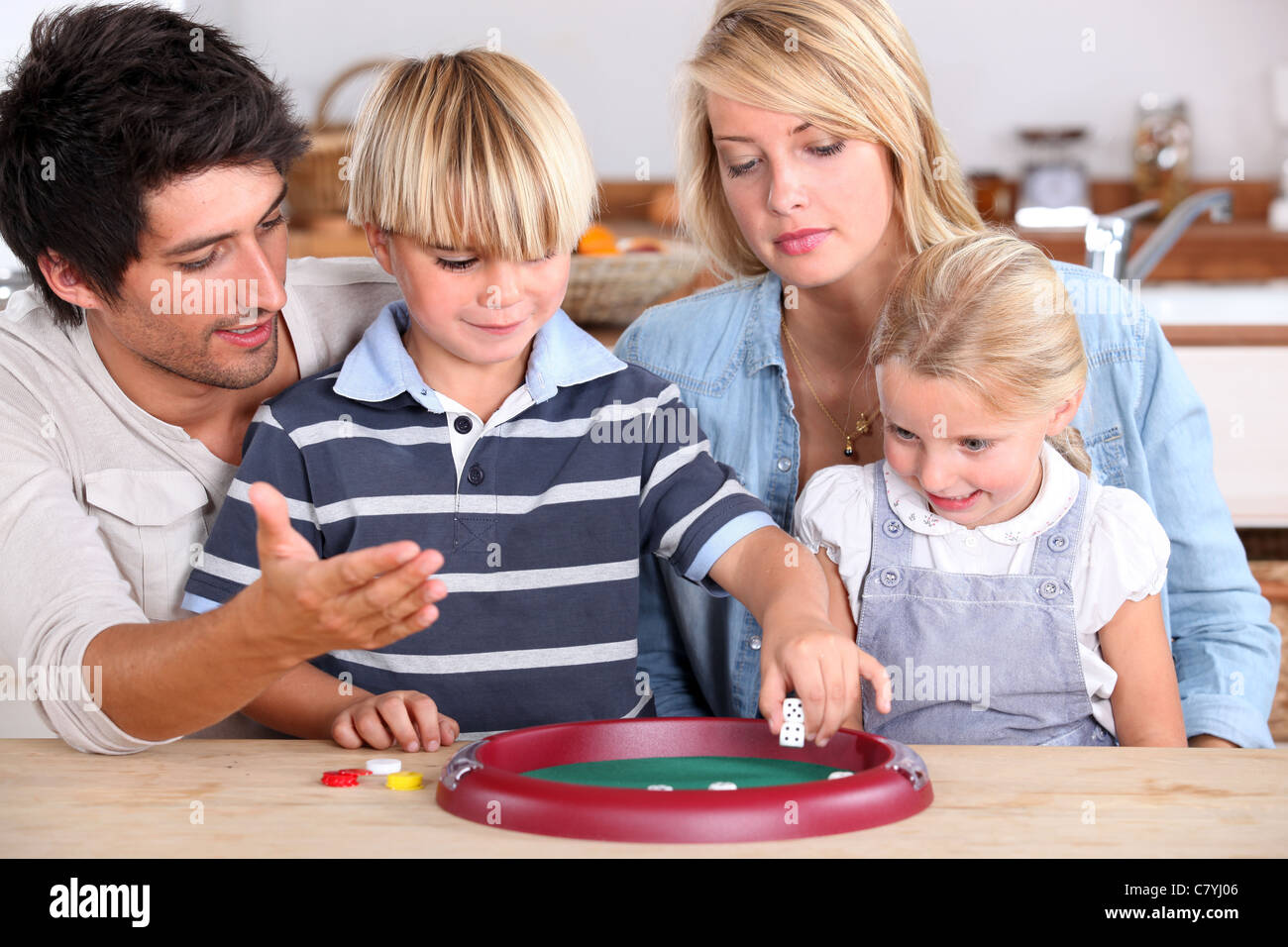 Family playing a game Stock Photo - Alamy