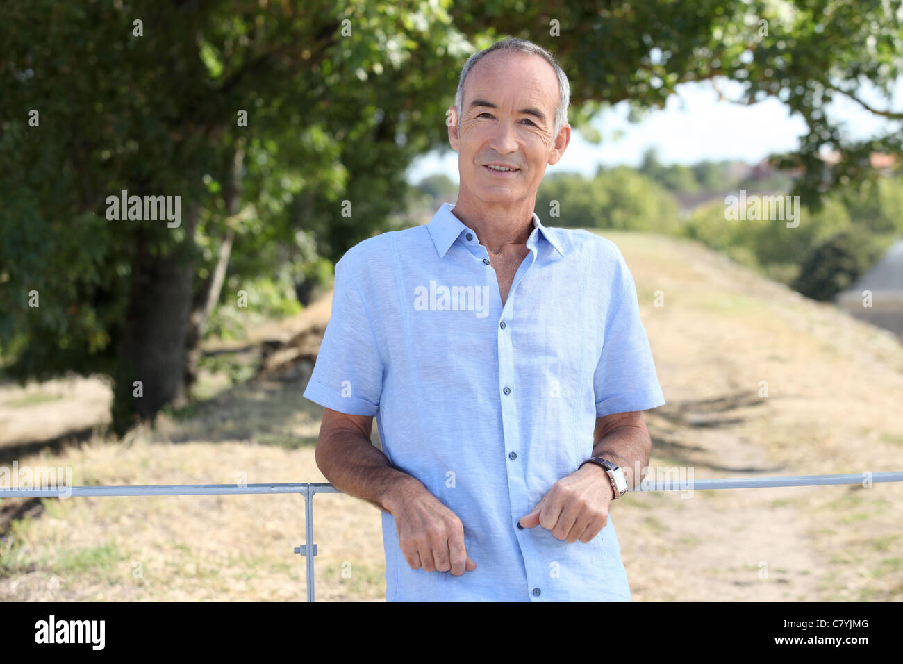 Male lean against fence hi-res stock photography and images - Alamy