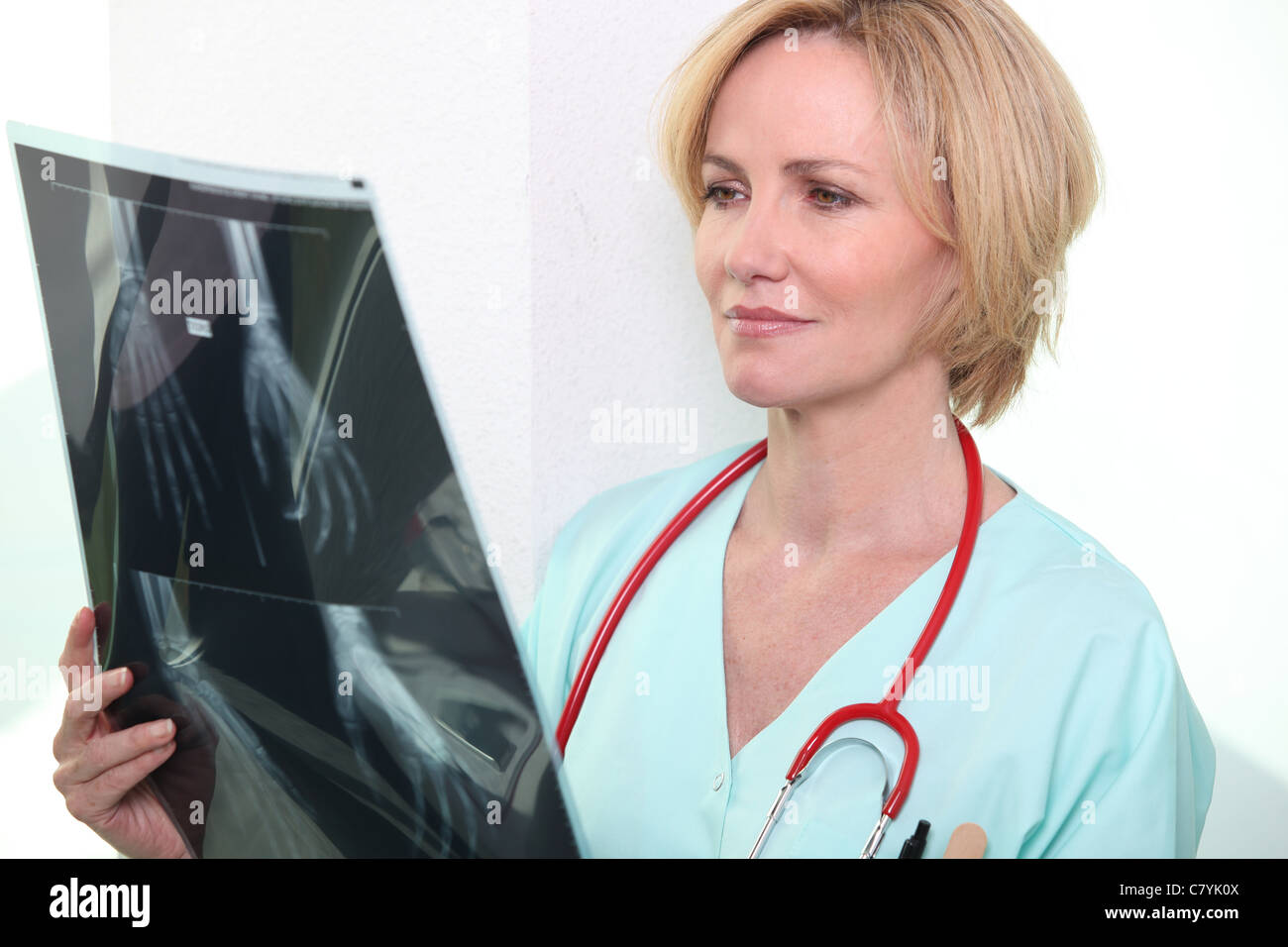 Female medic looking at x-rays Stock Photo - Alamy