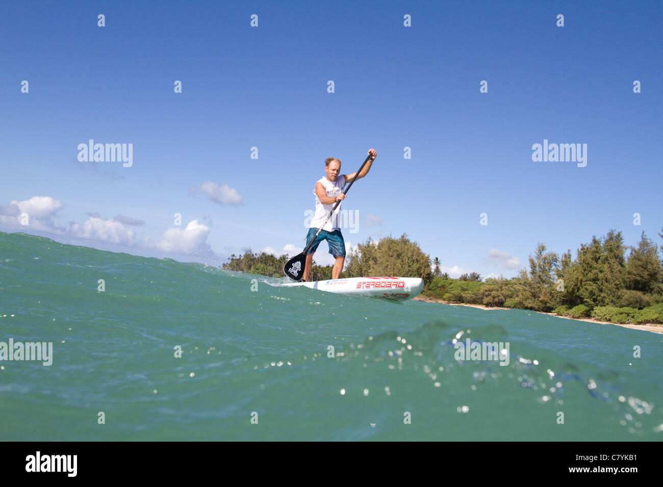 Pro stand up paddle board racer Stock Photo - Alamy
