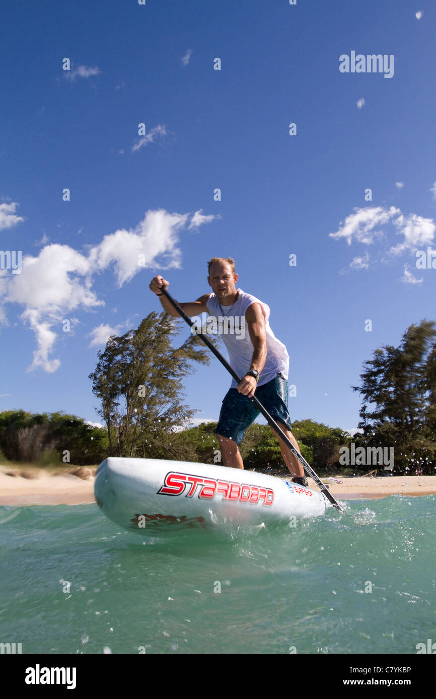 Pro stand up paddle board racer Stock Photo - Alamy