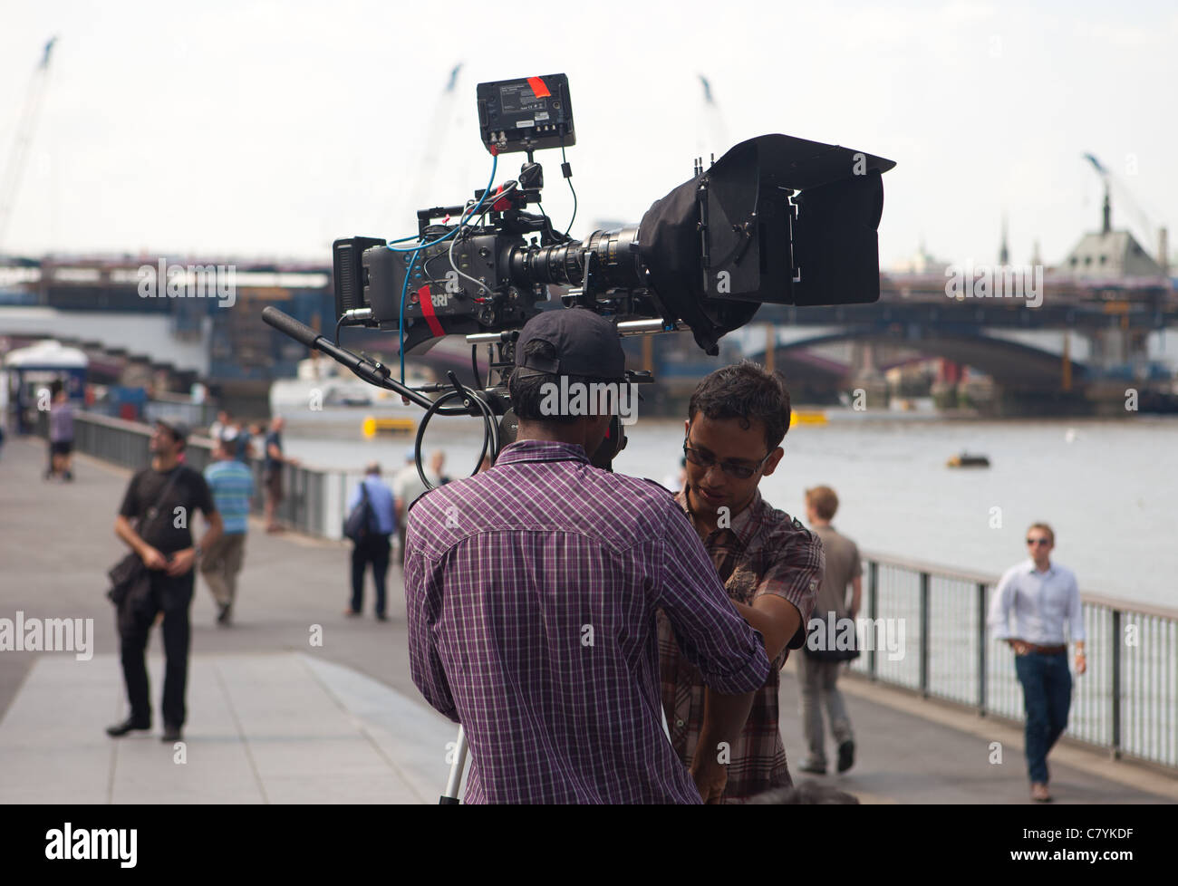 An Indian film crew on location in London at the side of the River ...