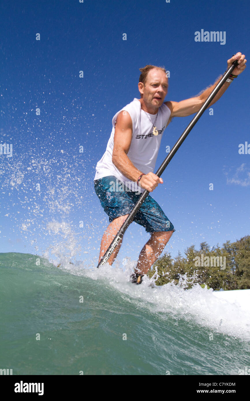 Pro stand up paddle board racer Stock Photo - Alamy