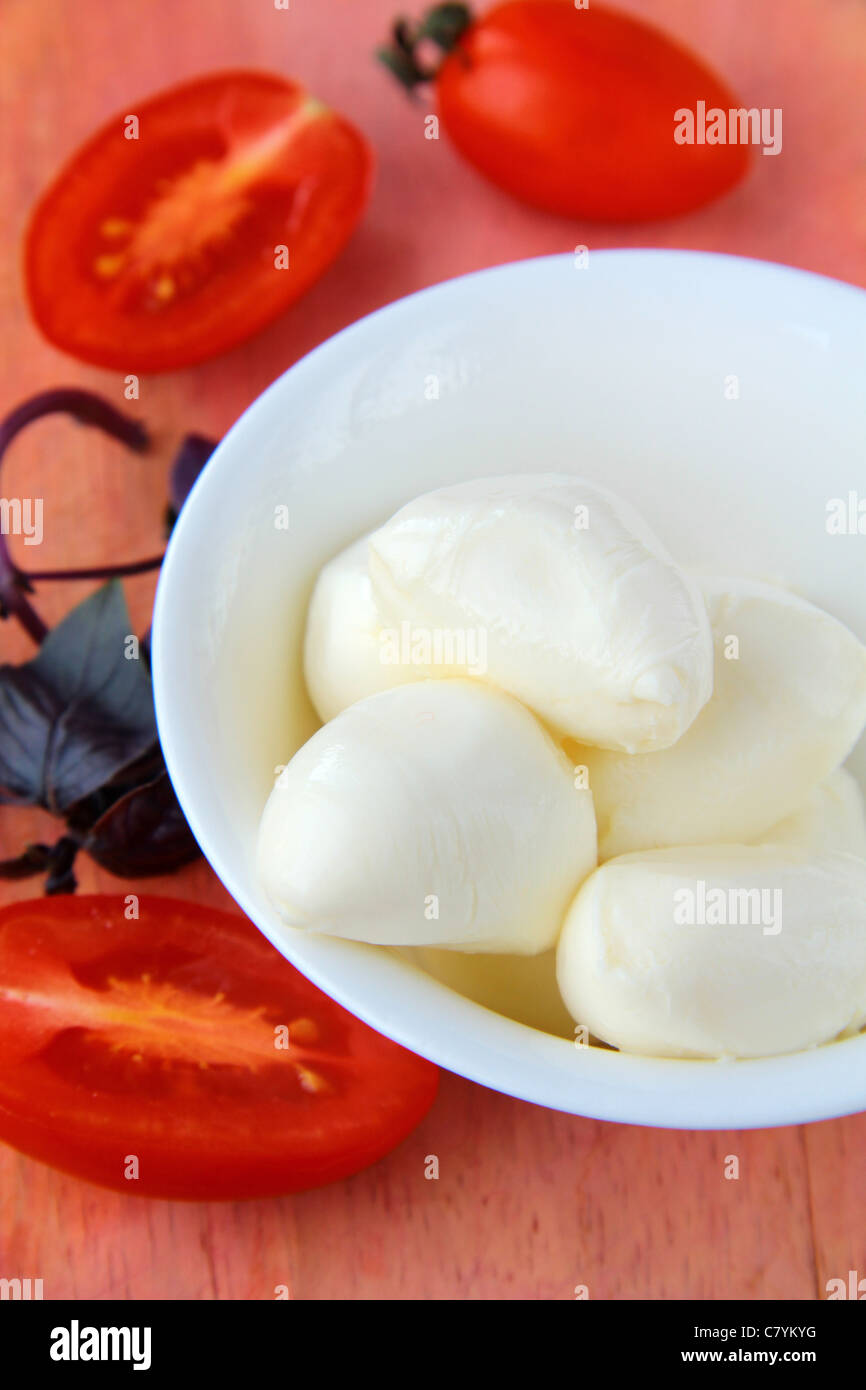 Baby mozzarella and tomato Stock Photo - Alamy