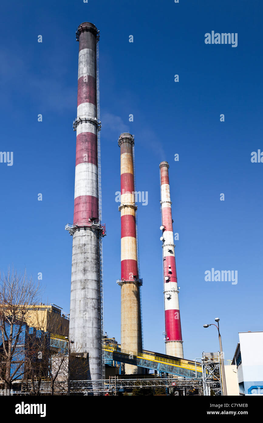 Big power plant with three high chimneys Stock Photo - Alamy
